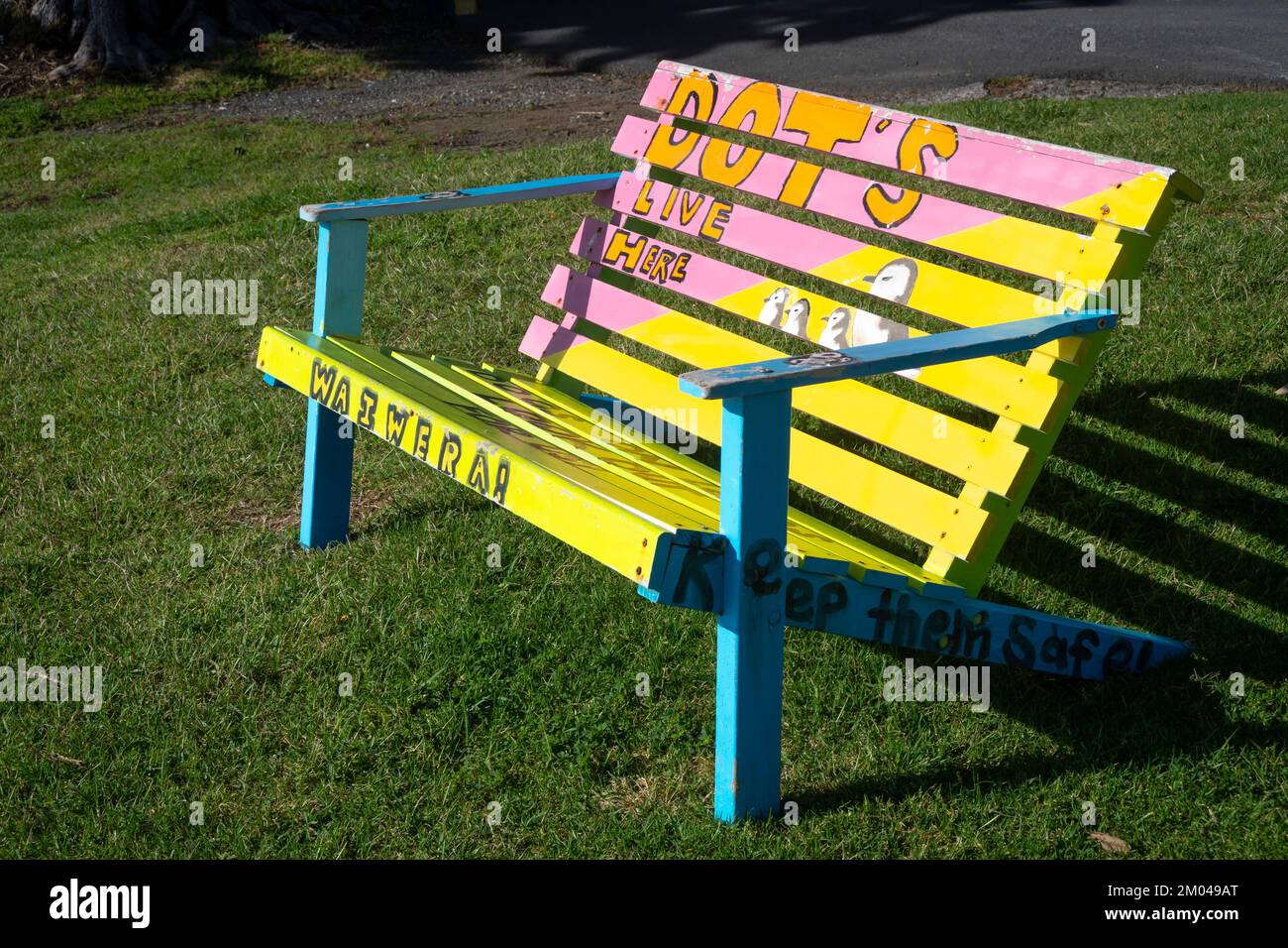 Painted park bench with slogans, protect nesting birds, Waiwera Beach ...