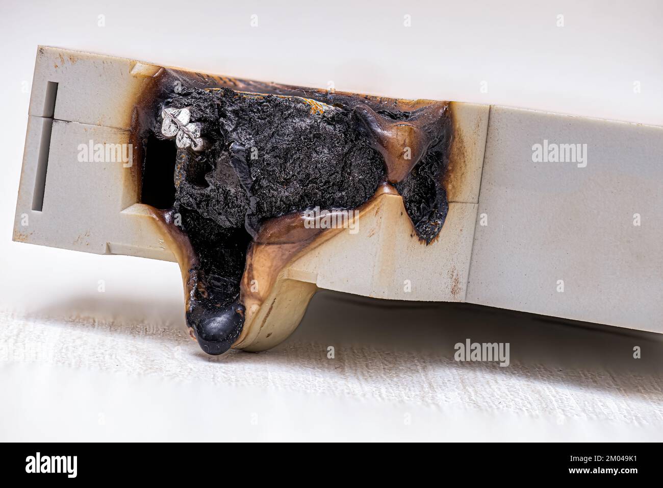 Macro photography of a burnt electrical circuit breaker with melted ...