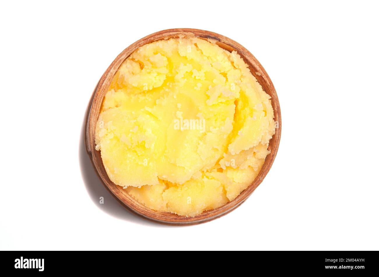 Ghee in wooden bowl isolated on white background top view Stock Photo ...