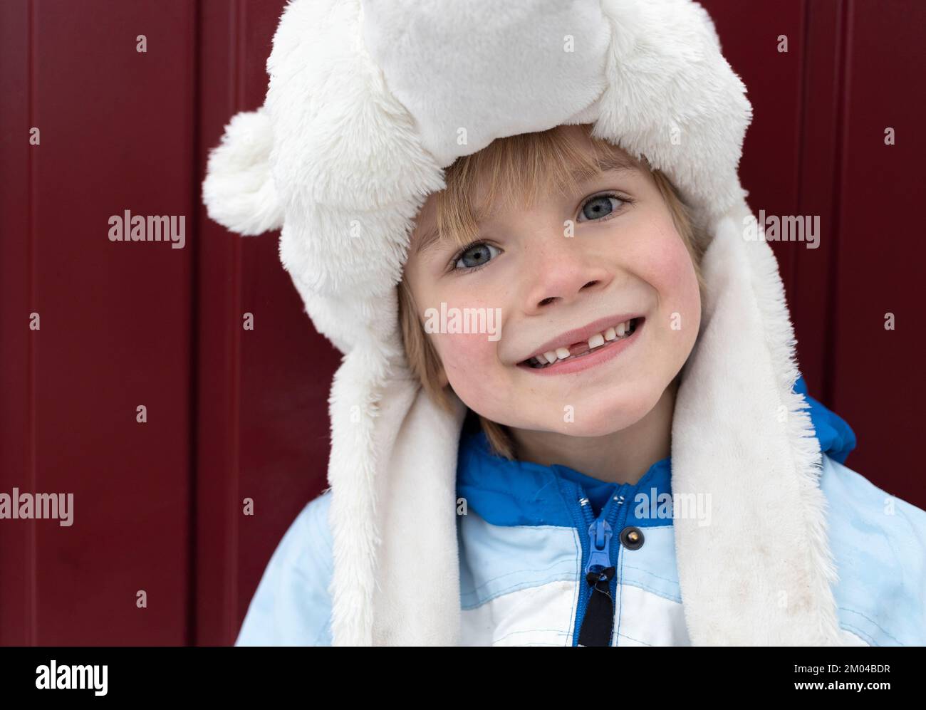 cute portrait of face of preschooler boy with sincere toothless smile ...