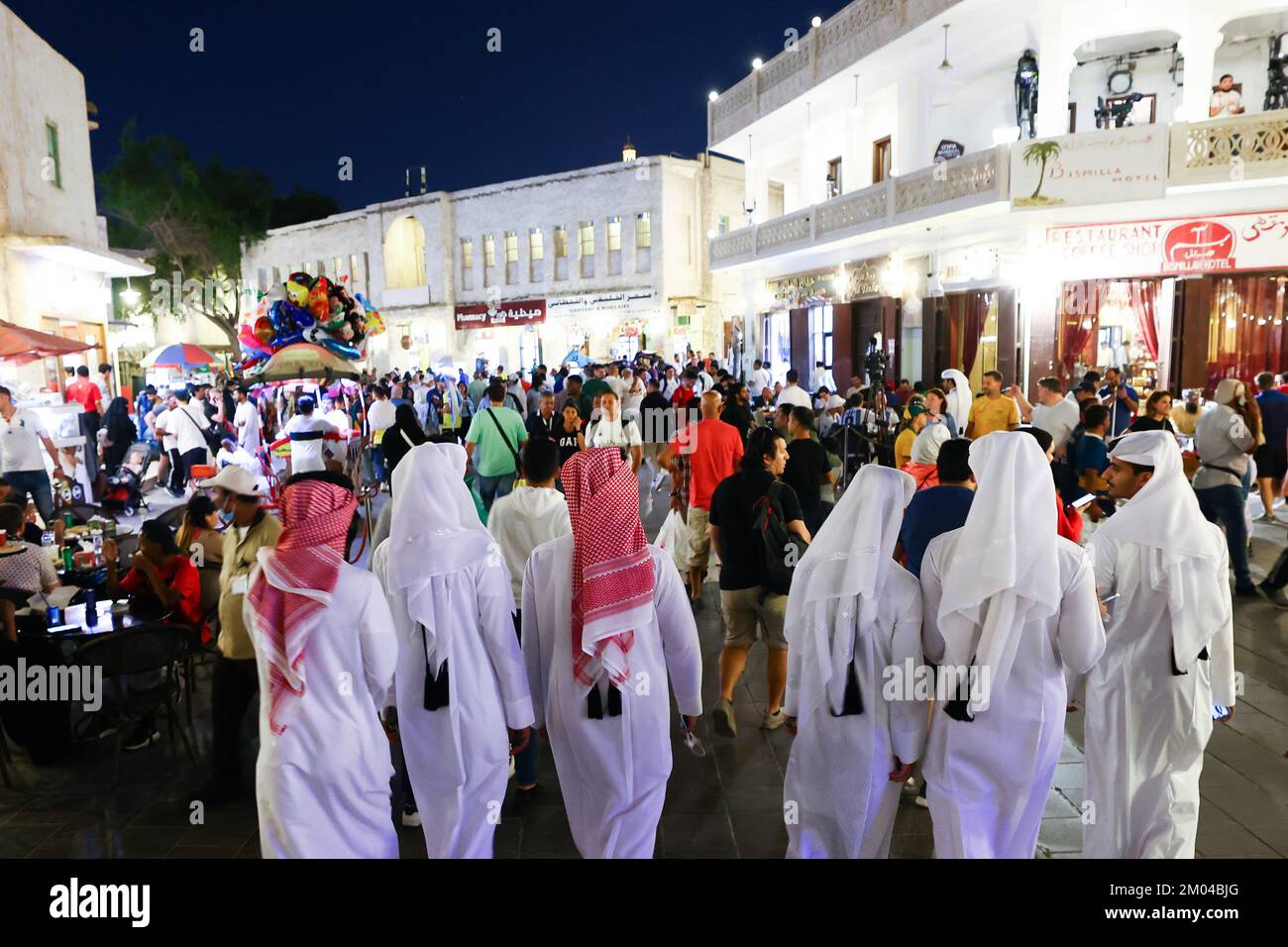 Doha, Qatar. 03rd Dec, 2022. Tourists and locals walk through the ...