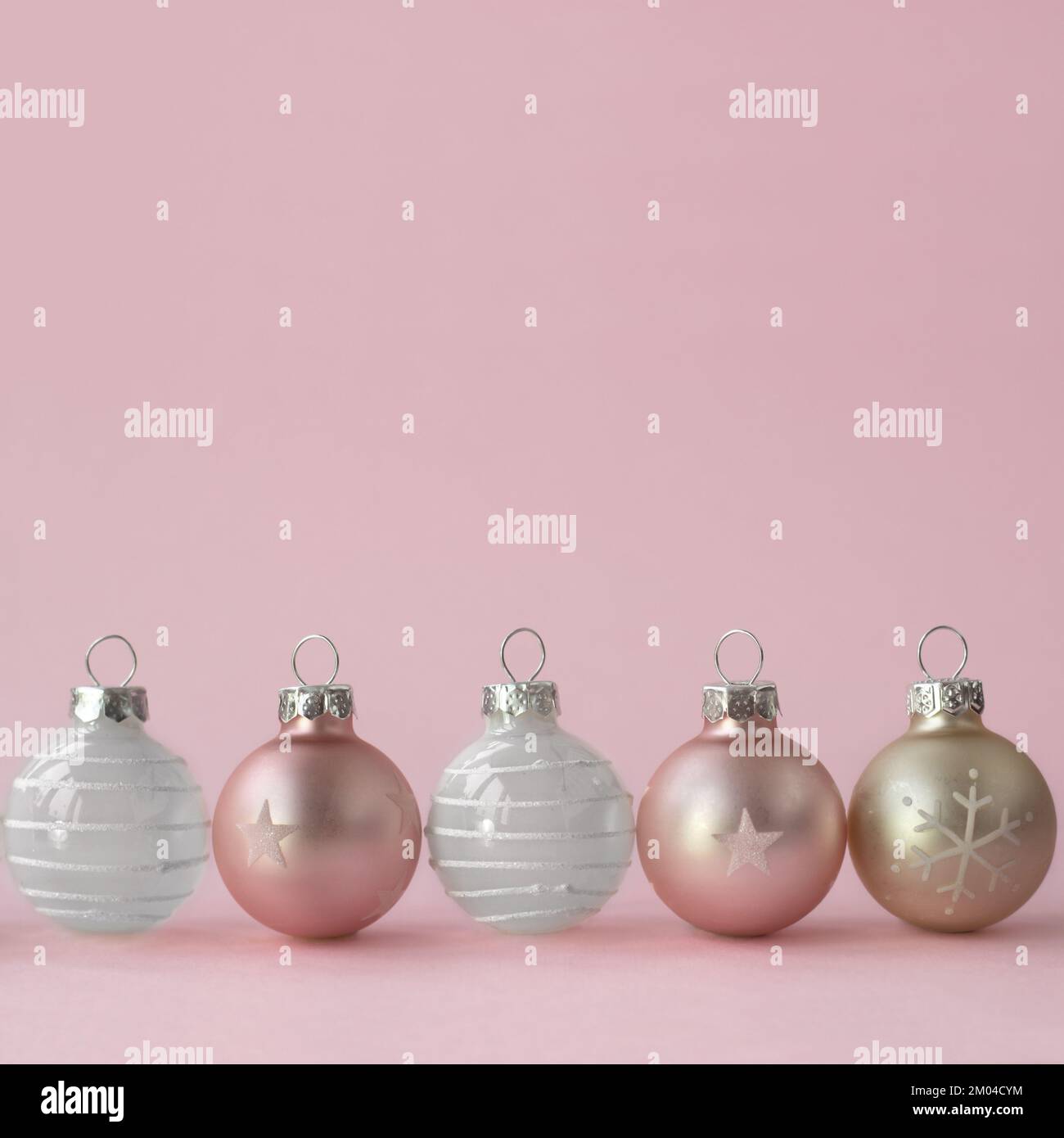 Christmas baubles in champagne color on pink background; Minimal ...