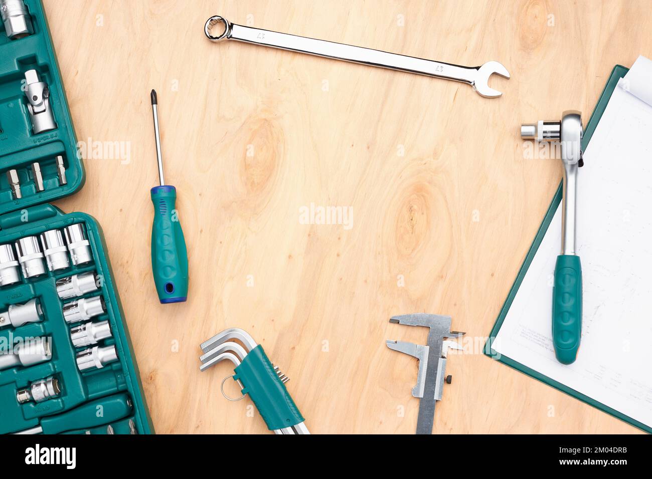 Workshop table with many tools. Wrench, spanner, calliper and ratchet ...