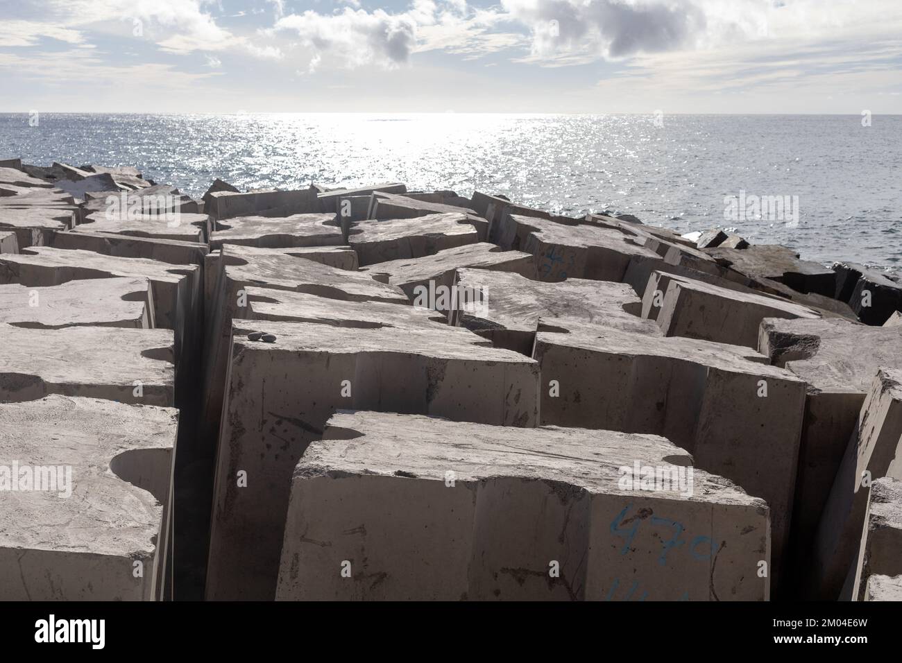 breakwater concrete blocks in the ocean sunny day Stock Photo - Alamy
