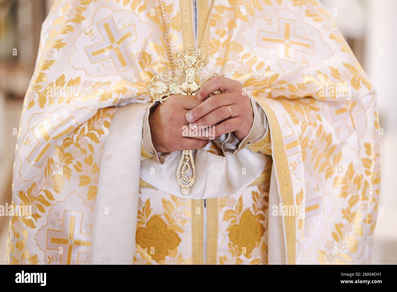 Middle selection of the priest holds a cross in his hands Stock Photo ...