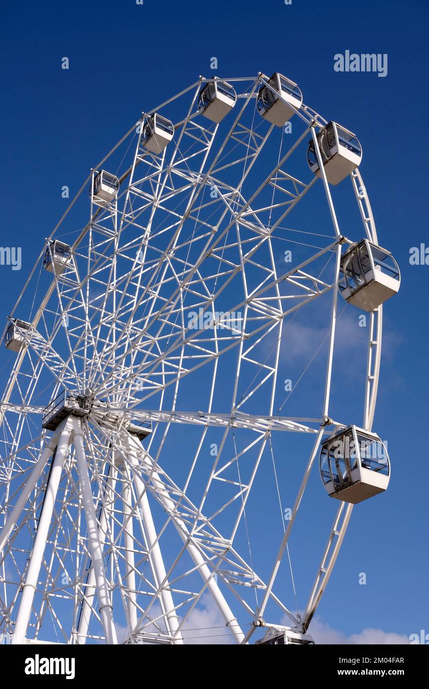 Circle ferris wheel from white metal construction with many rotating ...