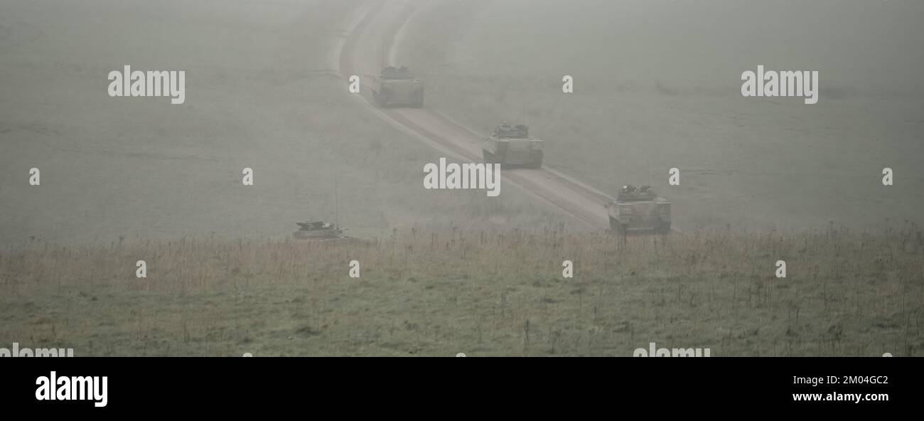 a unit British army Warrior FV510 infantry fighting vehicle in action ...