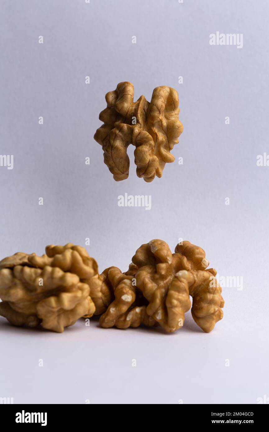 dry peeled walnut on white background Stock Photo - Alamy