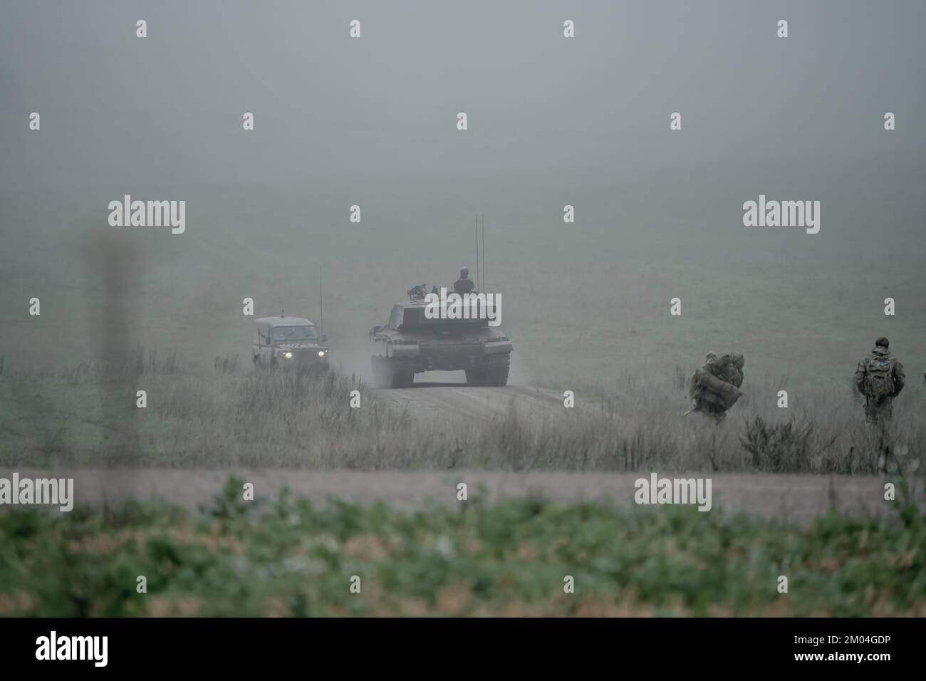 a Challenger 2 II FV4034 Main Battle Tank passing a unit of British ...