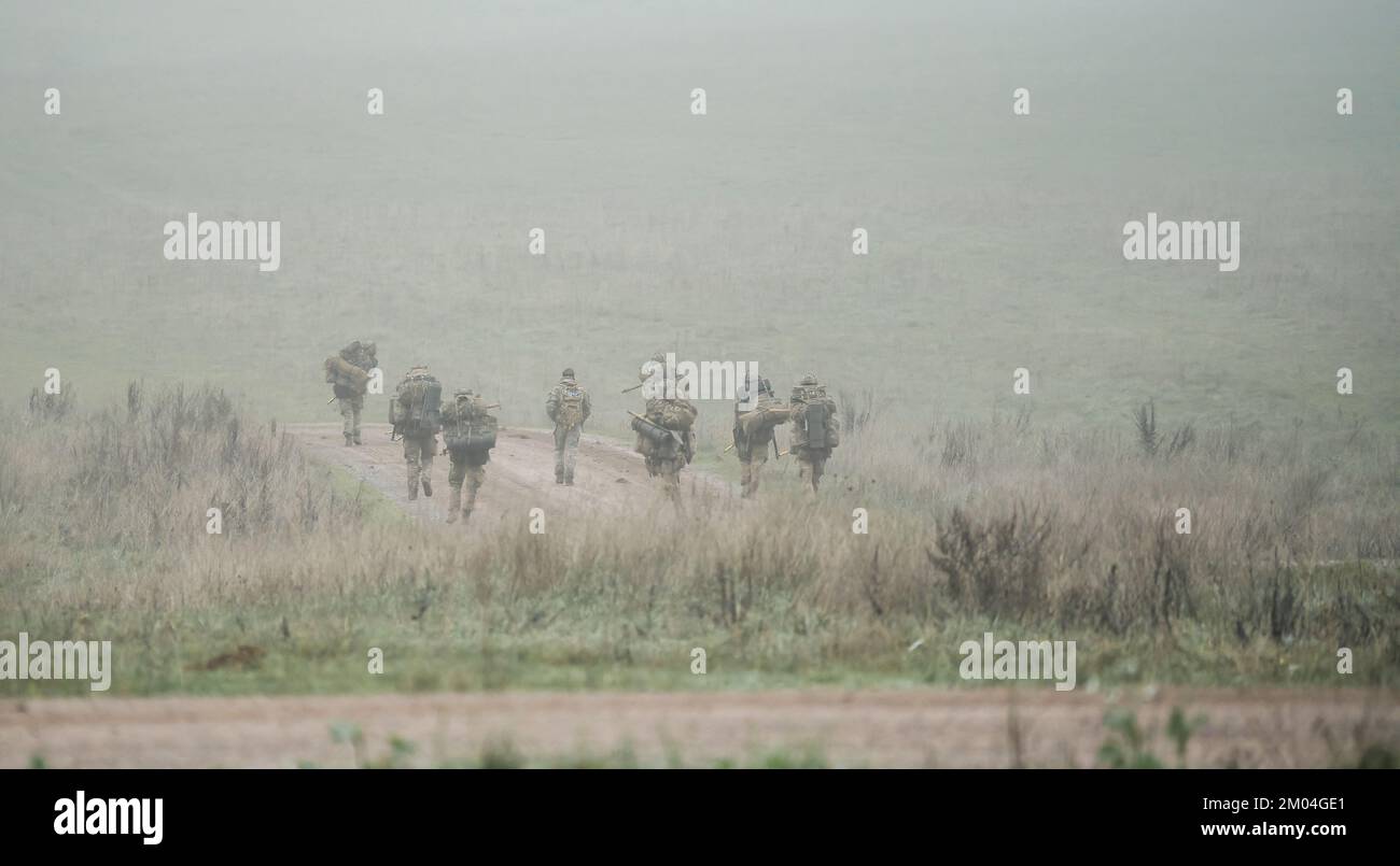 a unit of British army soldiers on a 40kg loaded march tab military ...