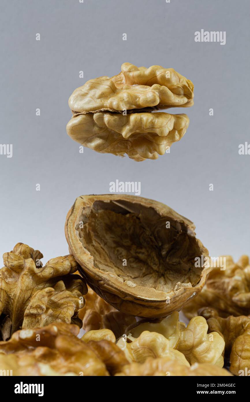 dry peeled walnut on white background Stock Photo - Alamy