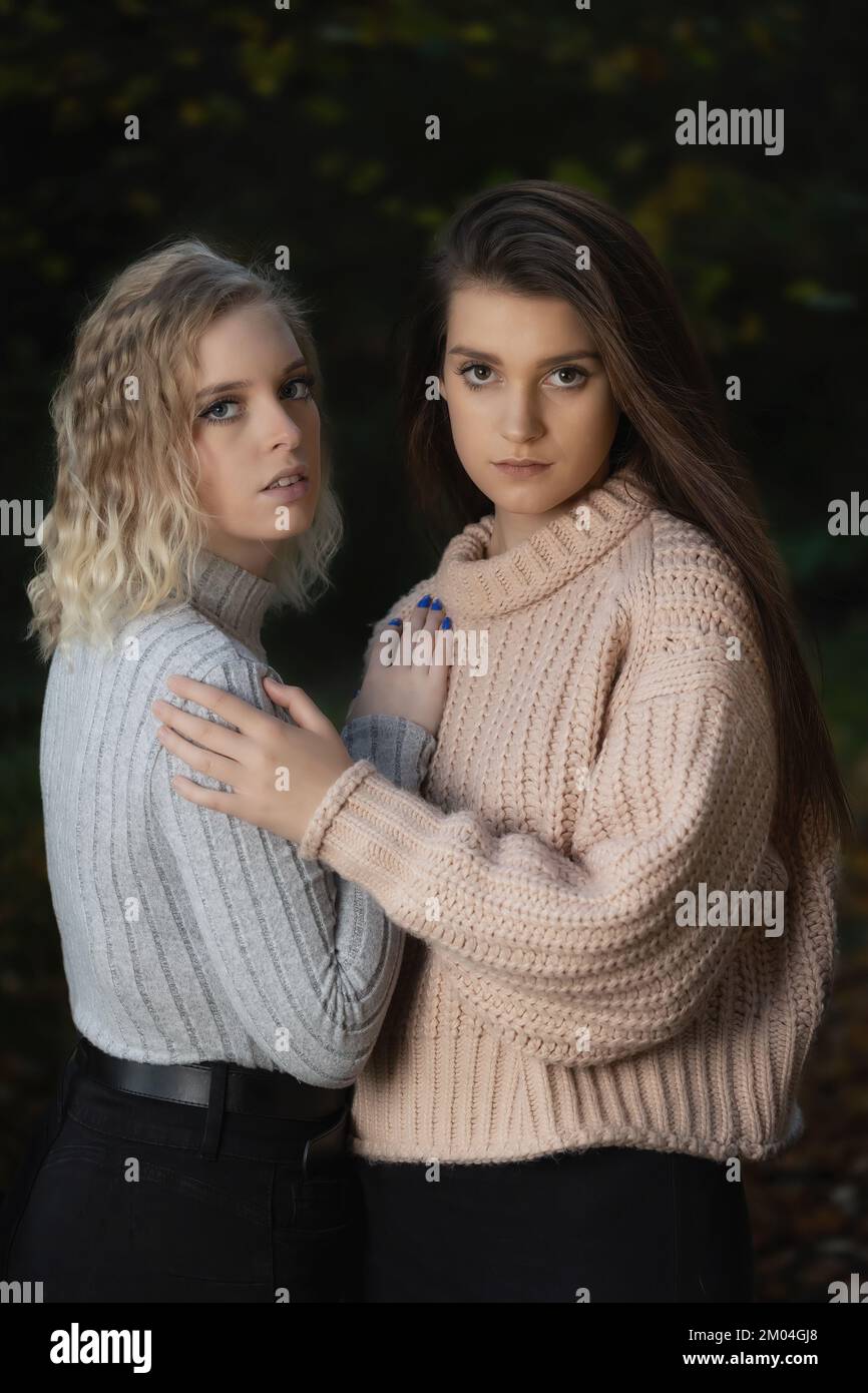 Portrait of beautiful two girls holding each other. Vertically Stock ... Portrait of beautiful two girls holding each other. Vertically Stock ...
