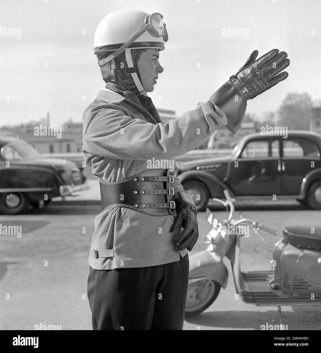 In the 1950s. A young woman seen on a german made Puch scooter. The ...
