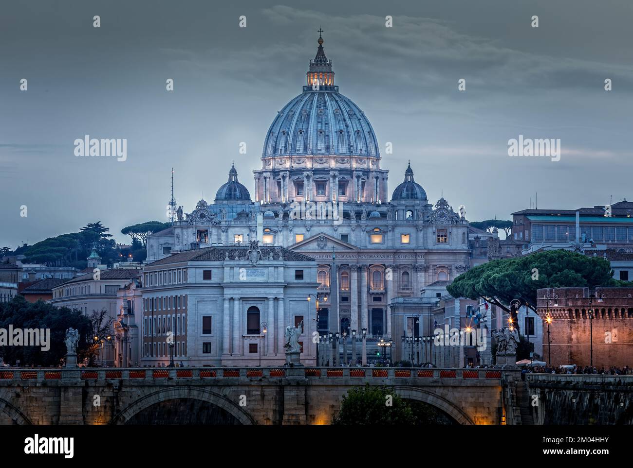 Saint Peter"s Basilica and the Santangelo bridge in the golden eveing ...