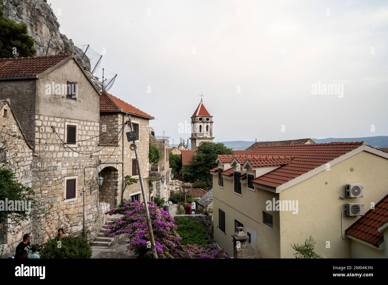 Omis, Croatia-August 18th, 2022: Tourists climbing stone stairs of ...