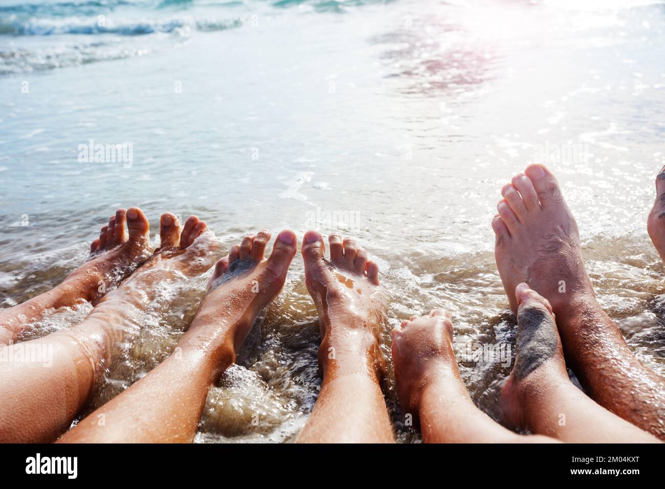 Feet in the waves hi-res stock photography and images - Alamy