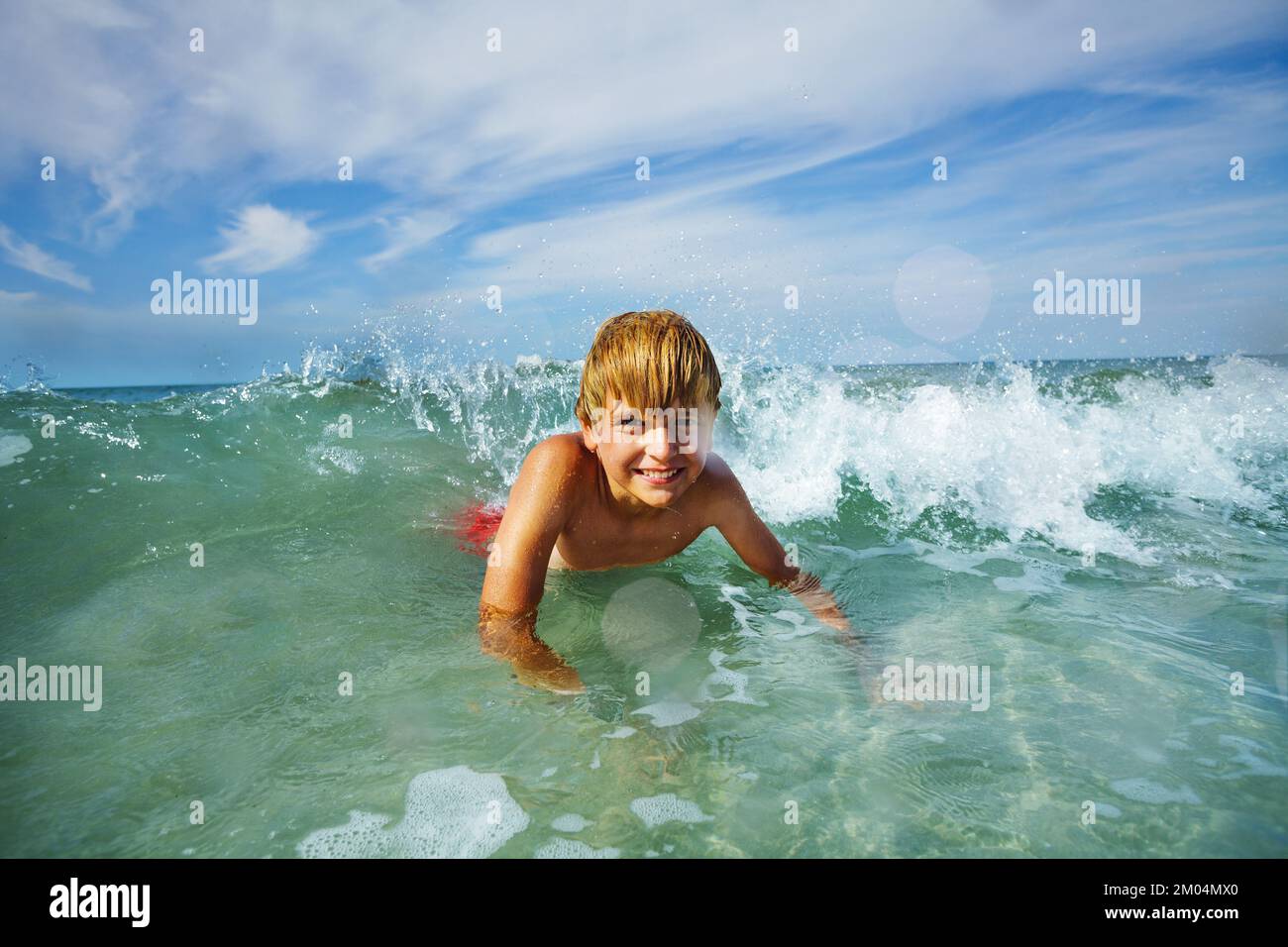 Boys jump into sea hi-res stock photography and images - Alamy