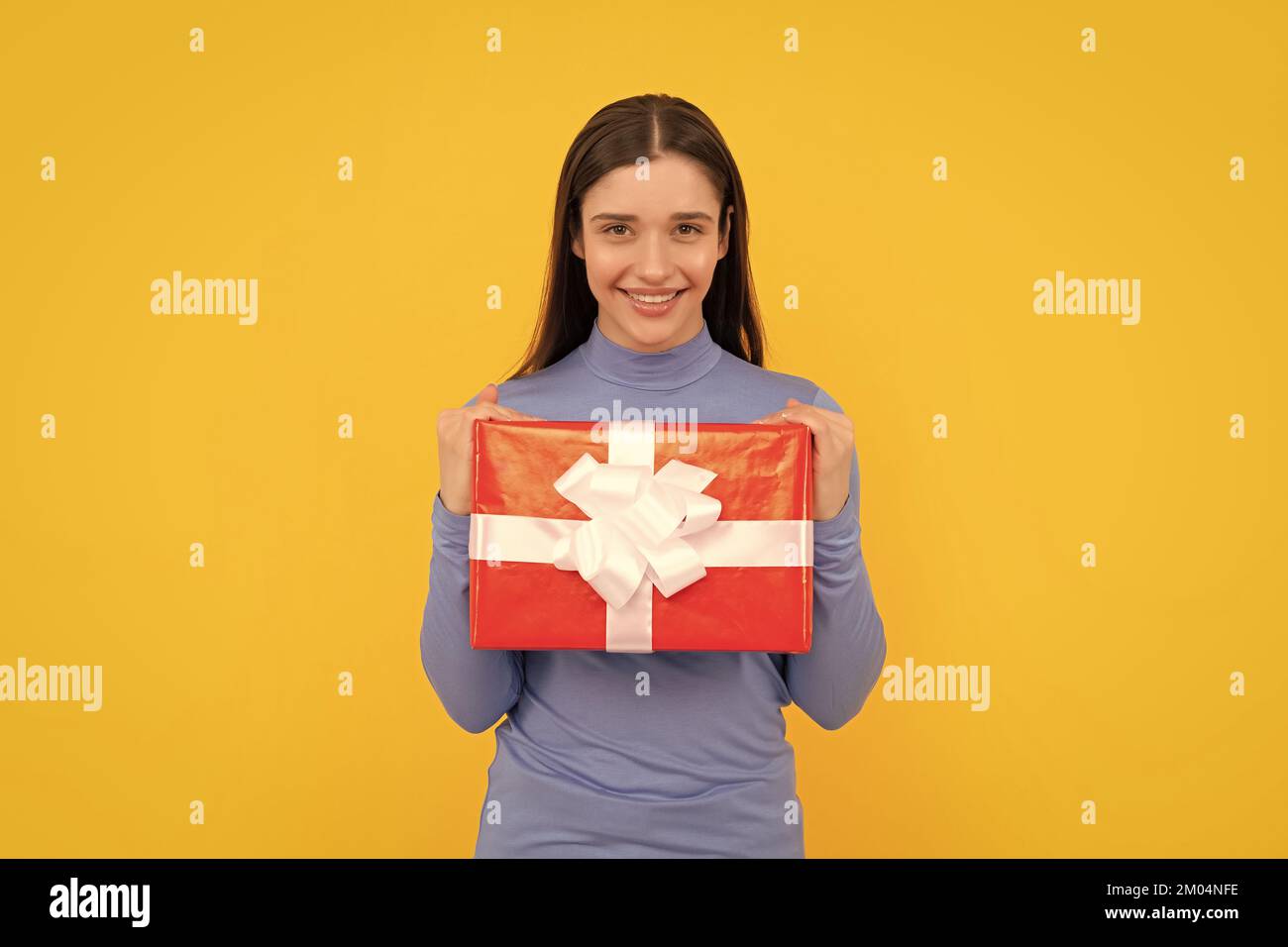 happy girl with giftbox on yellow background. boxing day. present and ...