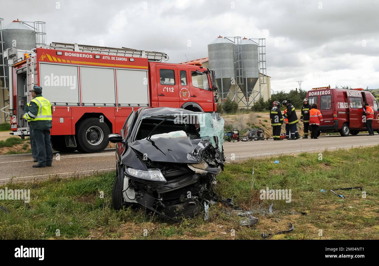 Wrecked car in front of a fire truck after being in a traffic accident ...