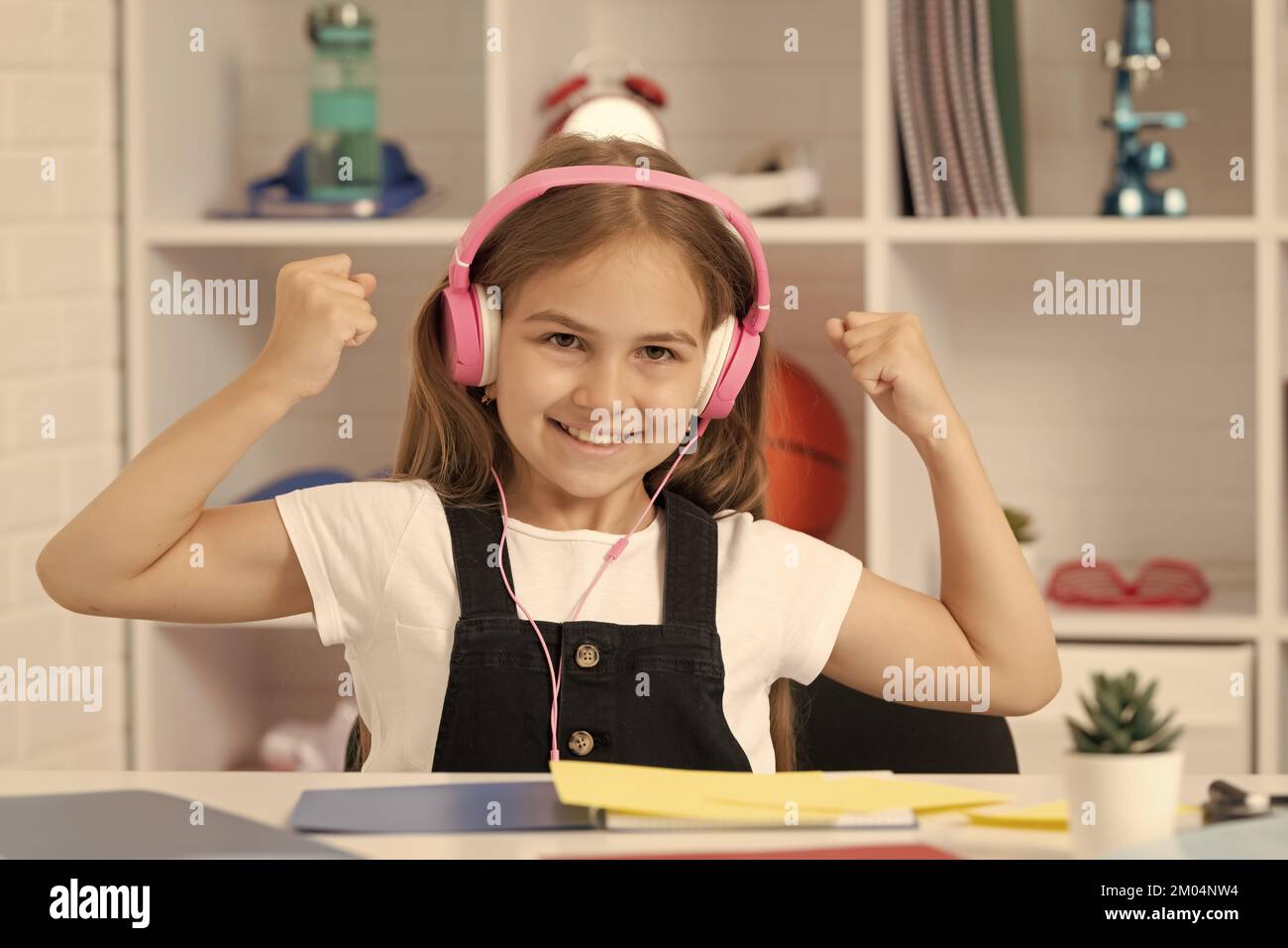 successful kid listen to music in headphones at school classroom Stock ...