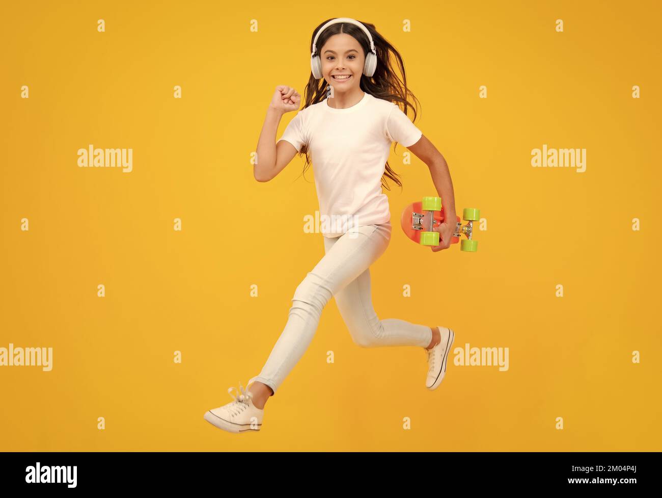 Jump and run. Teenagers youth casual culture. Teen girl with skateboard ...