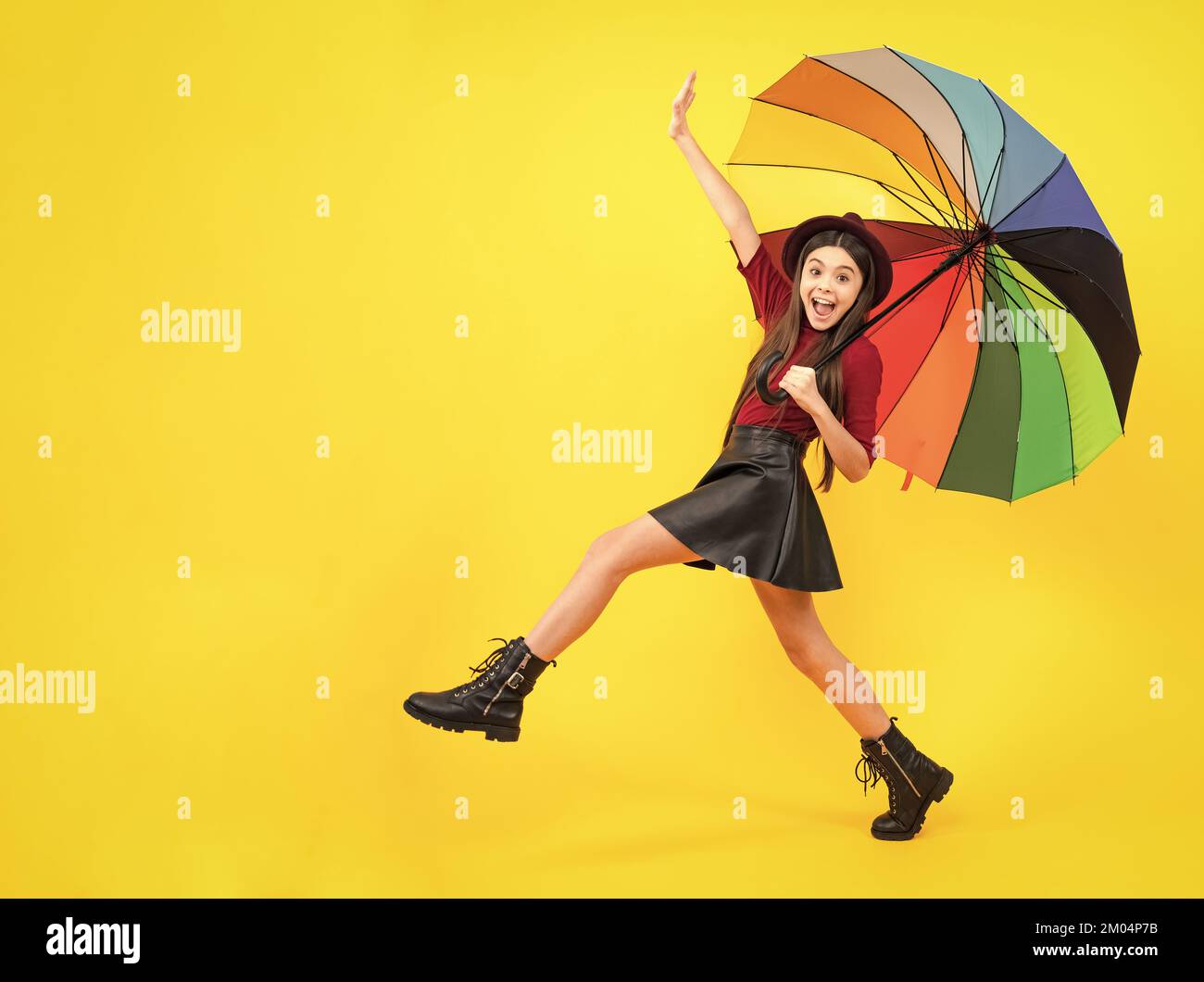 Child wuth umbrella under rain. Rainy weather, seasonal autumn. Excited ...