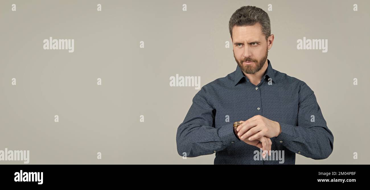 Man face portrait, banner with copy space. Checking his watch. Bearded ...