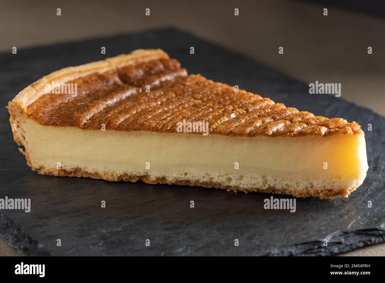 Slice of Parisian Flan (French Custard Pie) Classic tart. Baked ...