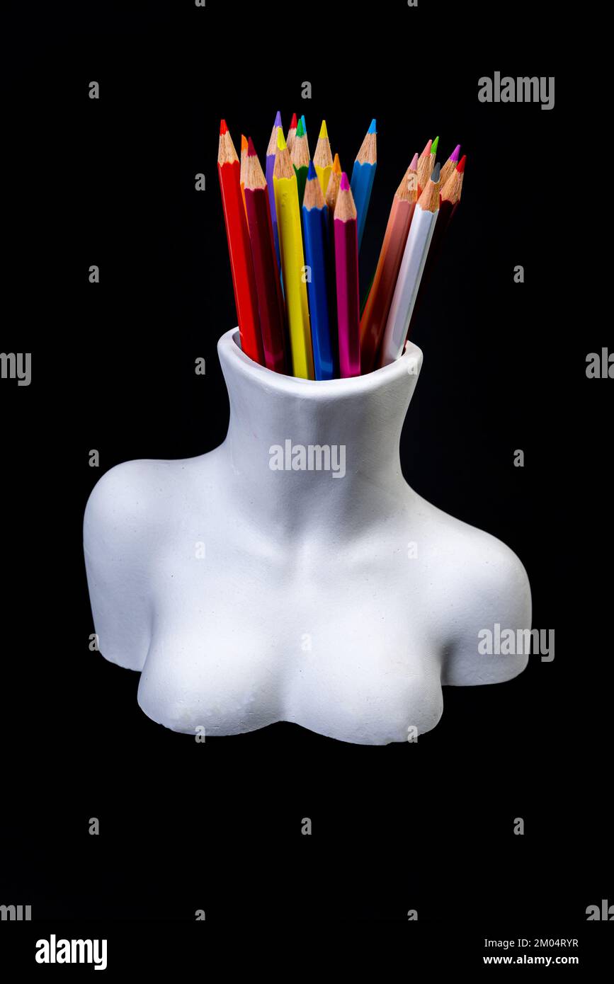 Color pencils for the drawing, located in a support as a vase, focus in ...