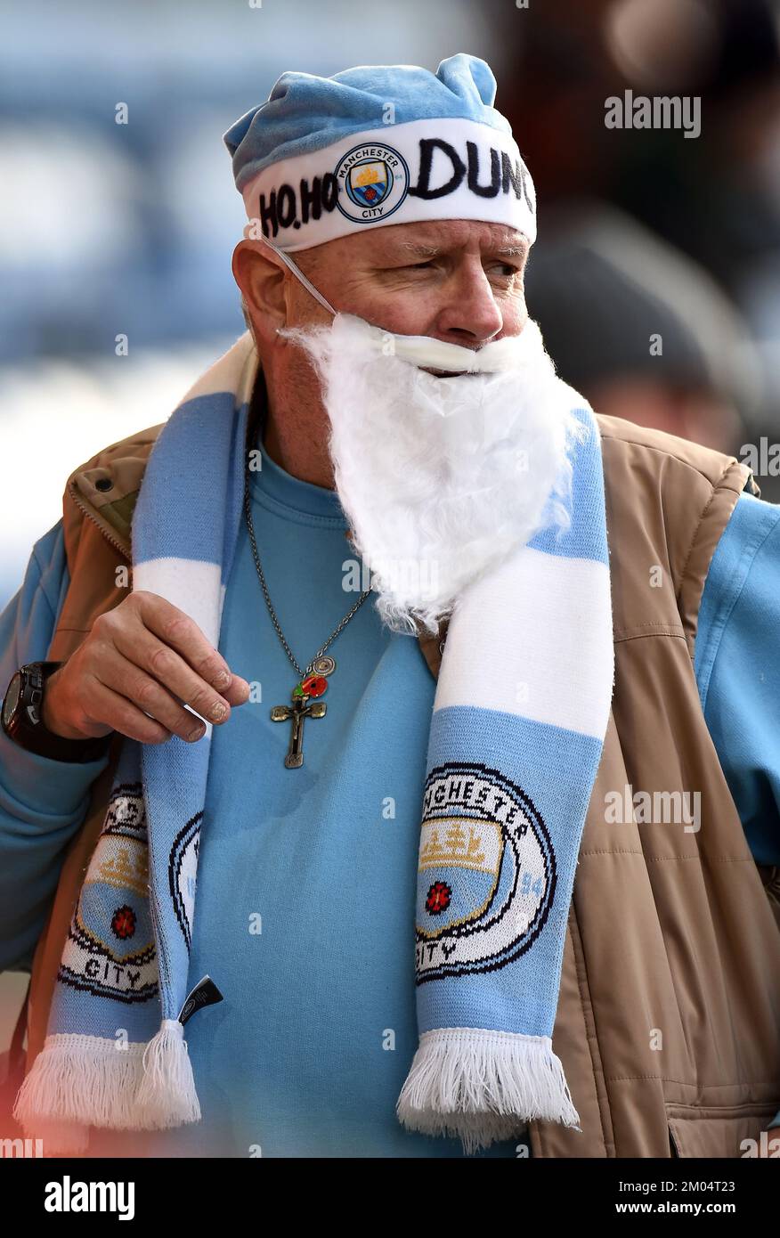 A Manchester City fan wearing a festive Santa Claus outfit during the ...