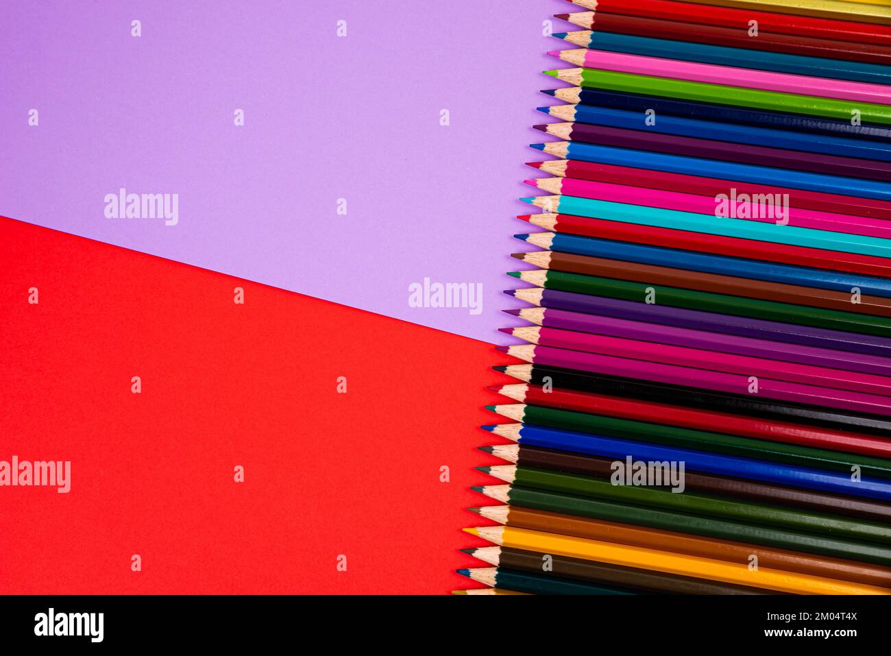 multi-colored pencils on multi-colored background, Close up, copy space ...