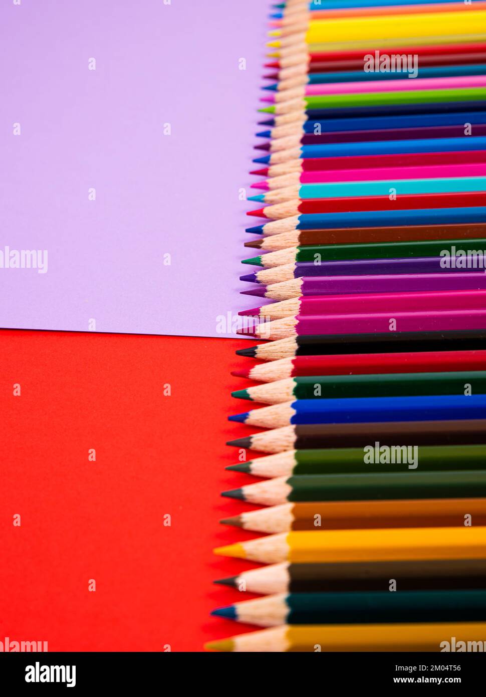 multi-colored pencils on multi-colored background, Close up, copy space ...