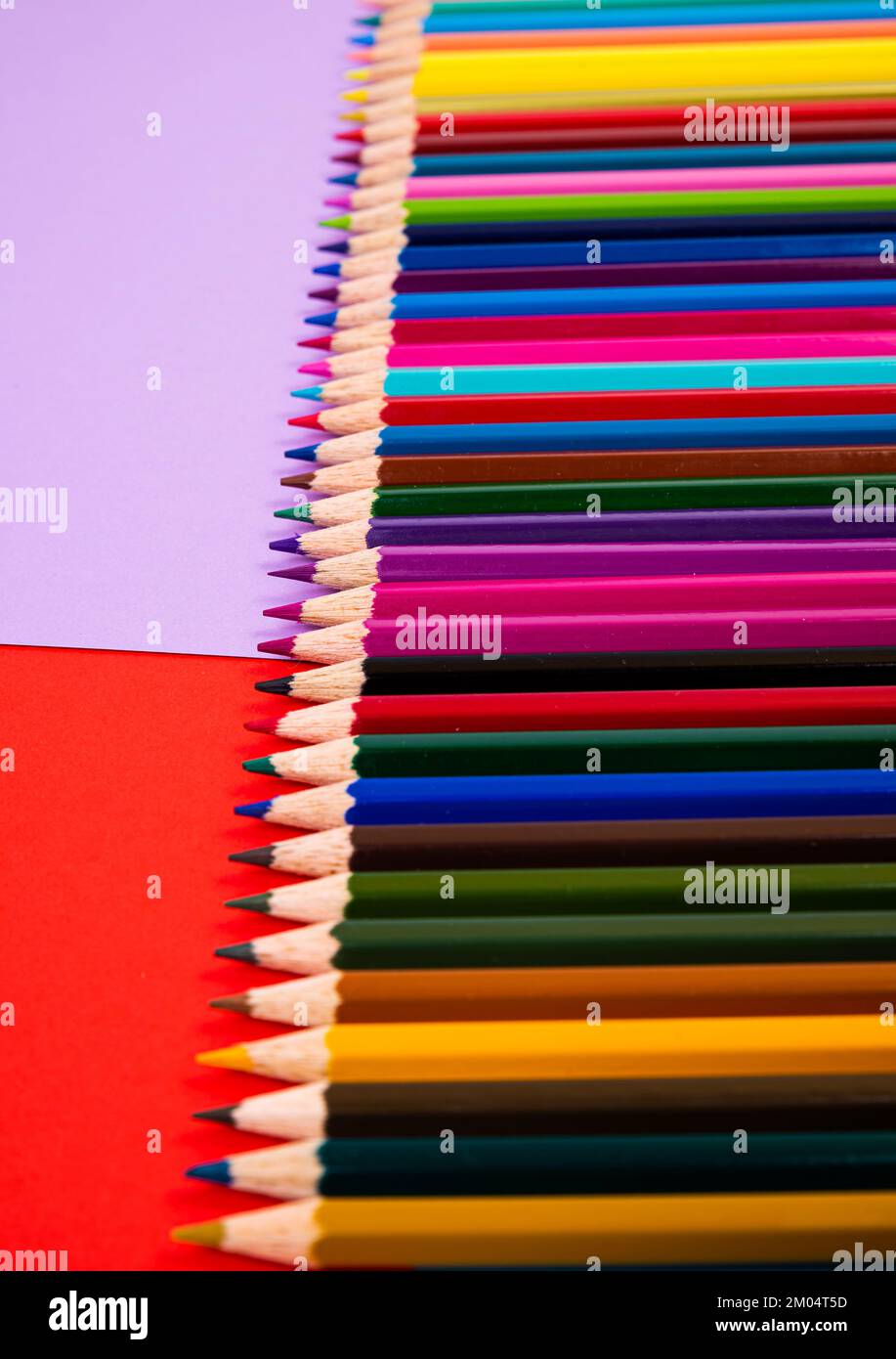 multi-colored pencils on multi-colored background, Close up, copy space ...