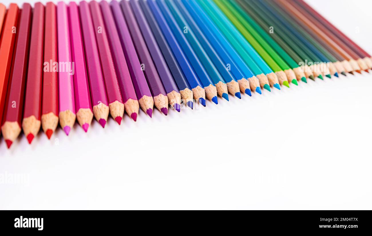 multi-colored pencils on multi-colored background, Close up, copy space ...