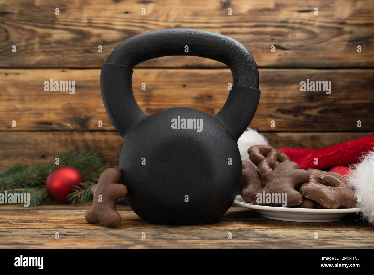 Kettlebell, chocolate gingerbread Christmas cookies, Santa Claus hat ...