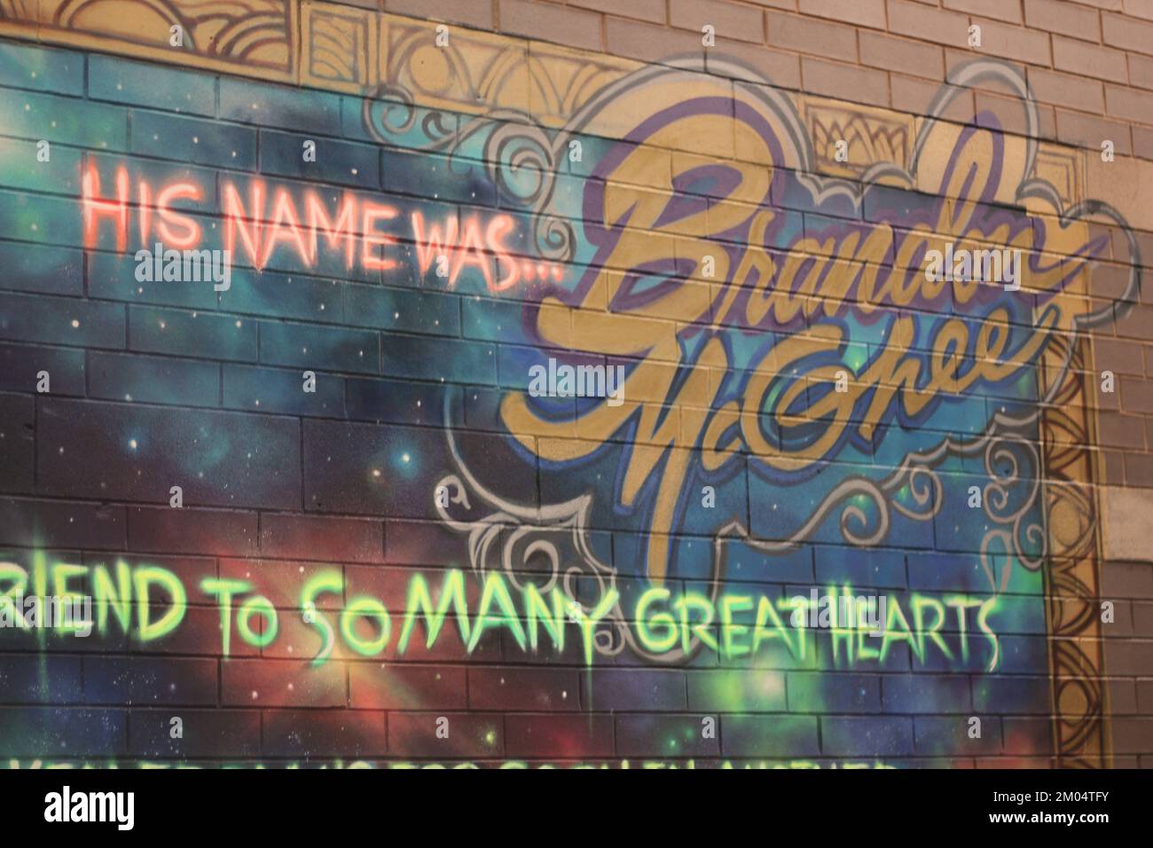 A tribute mural to Brandon McGhee spray painted on an inner city ...