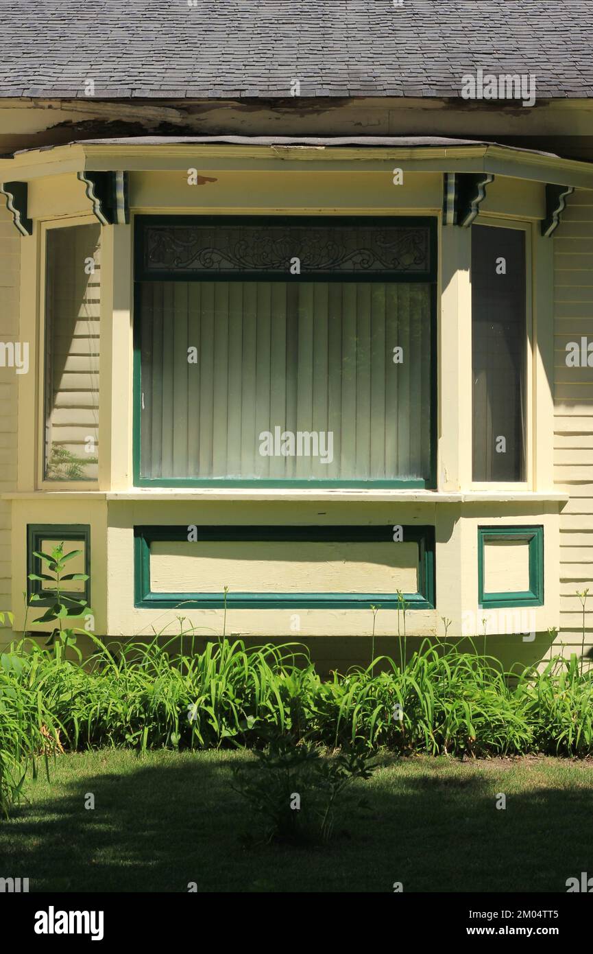 Traditional wooden cottage window on the wall of a house Stock Photo ...