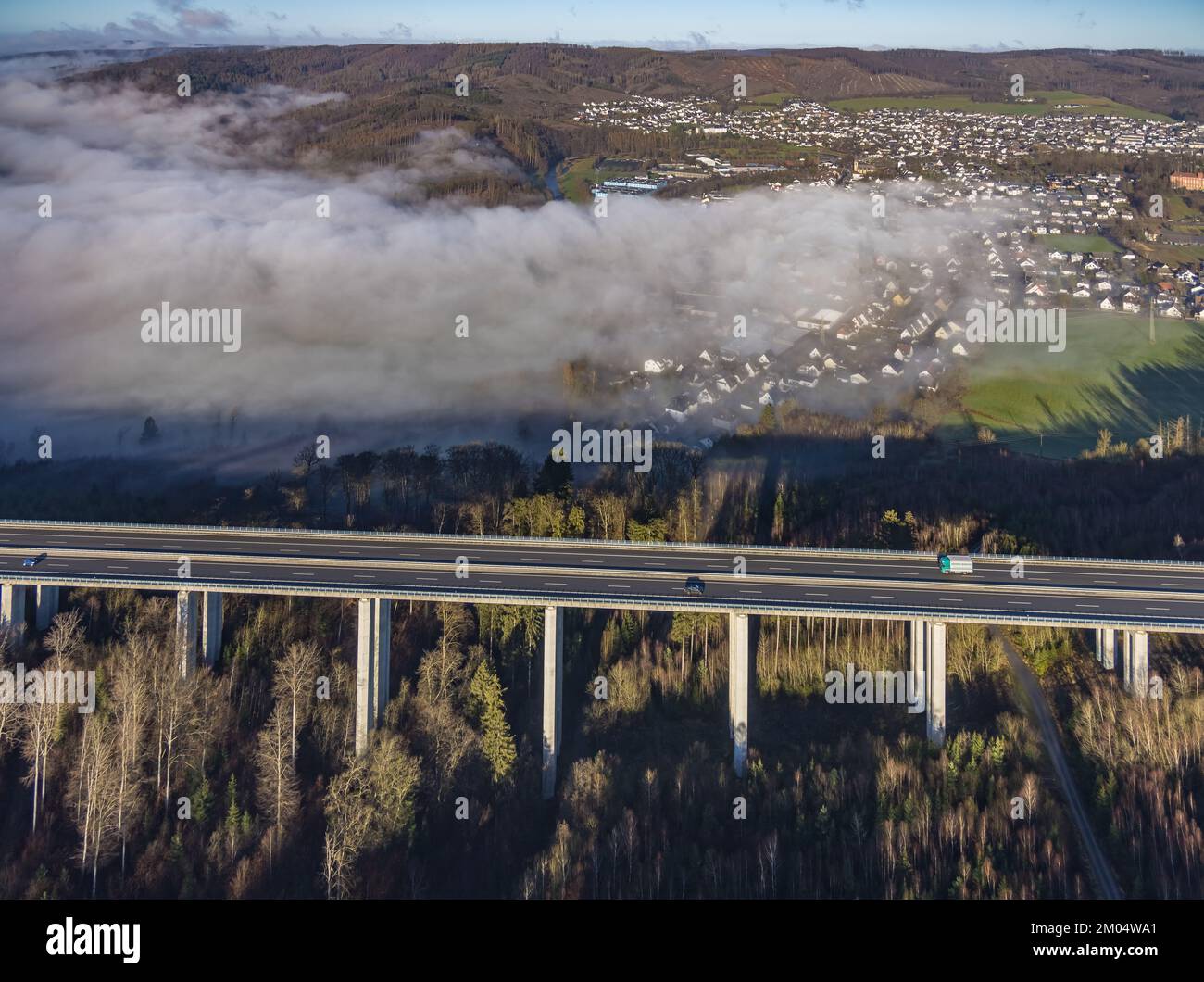 Aerial view, fog at the valley bridge Hünenburg of the highway A46 in ...