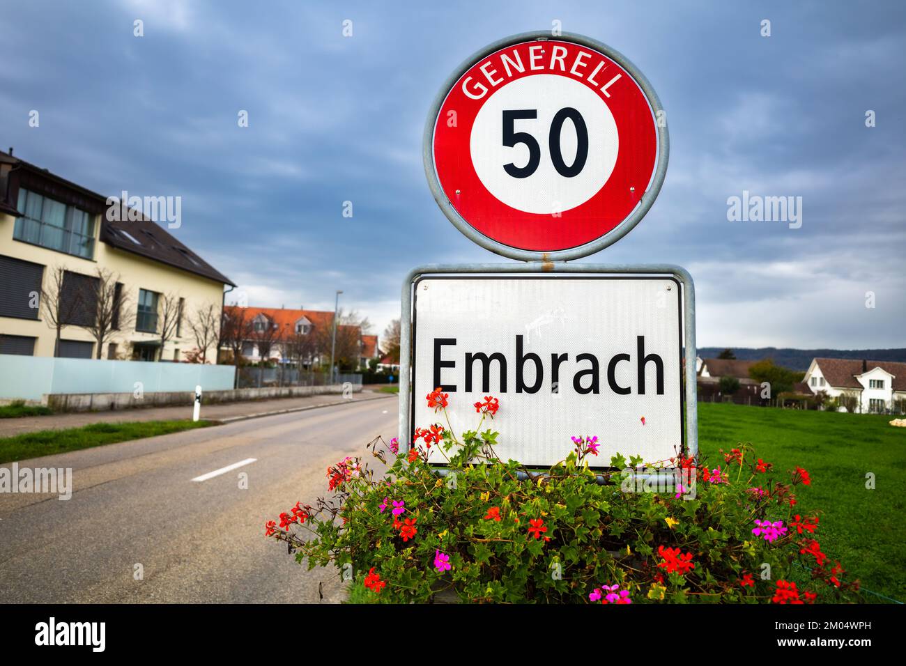 Local signboard of the town of Embrach in Switzerland with a speed ...