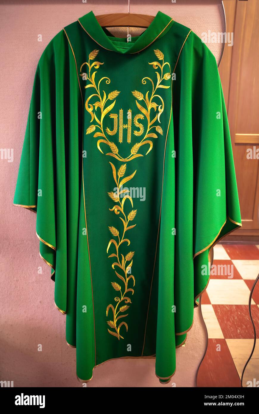 Green chasuble of the priest inside the sacristy of a Catholic church ...