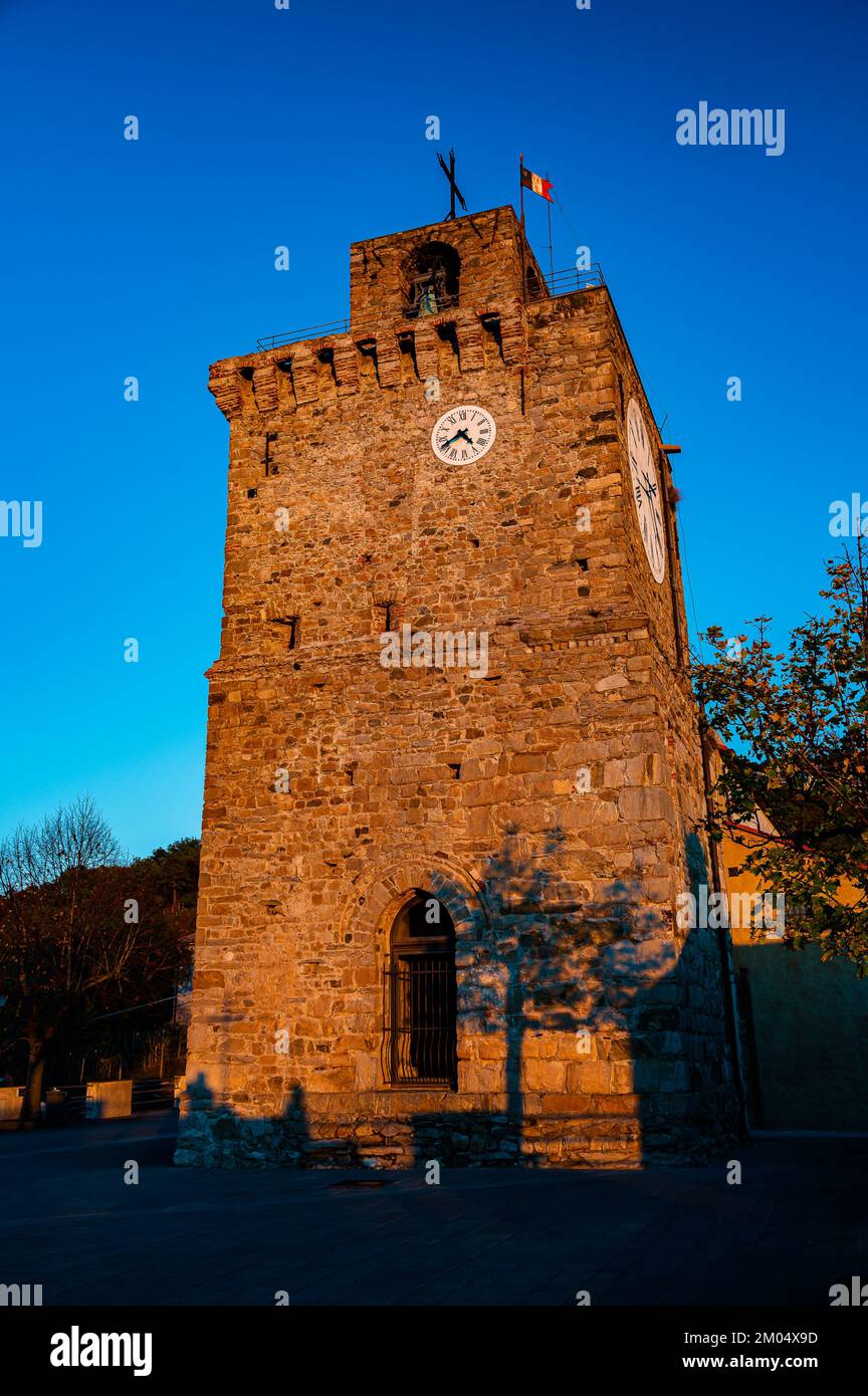 Old stone clock tower in the village of Framura on the Italian Riviera ...