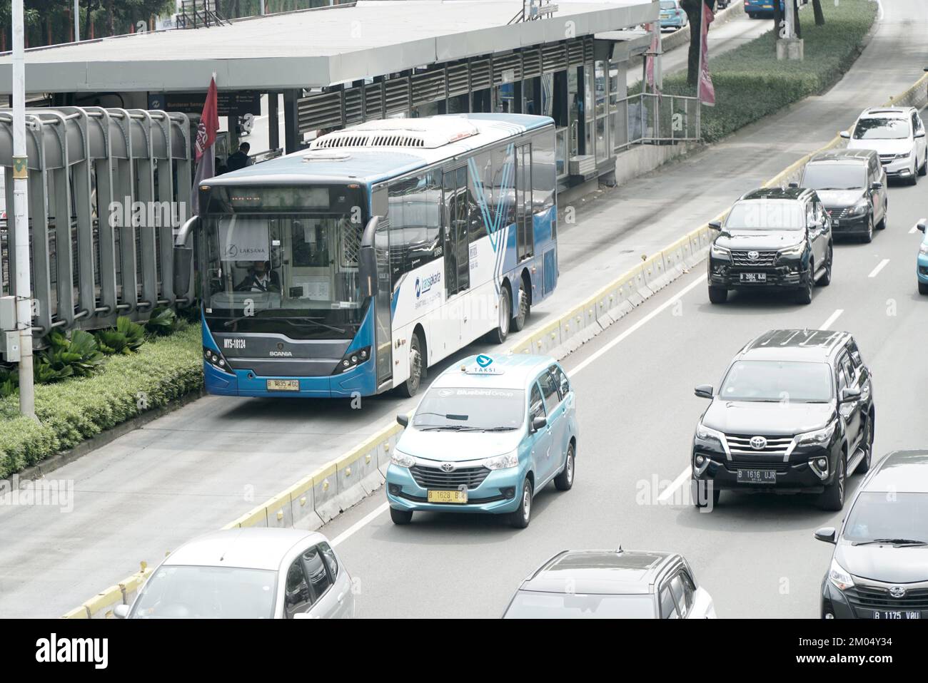 Trans Jakarta bus in bus way line, at the rush hour traffic. Location ...