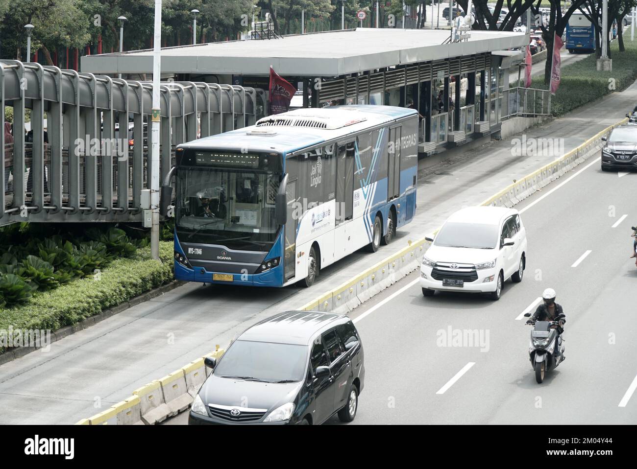 Trans Jakarta bus in bus way line, at the rush hour traffic. Location ...