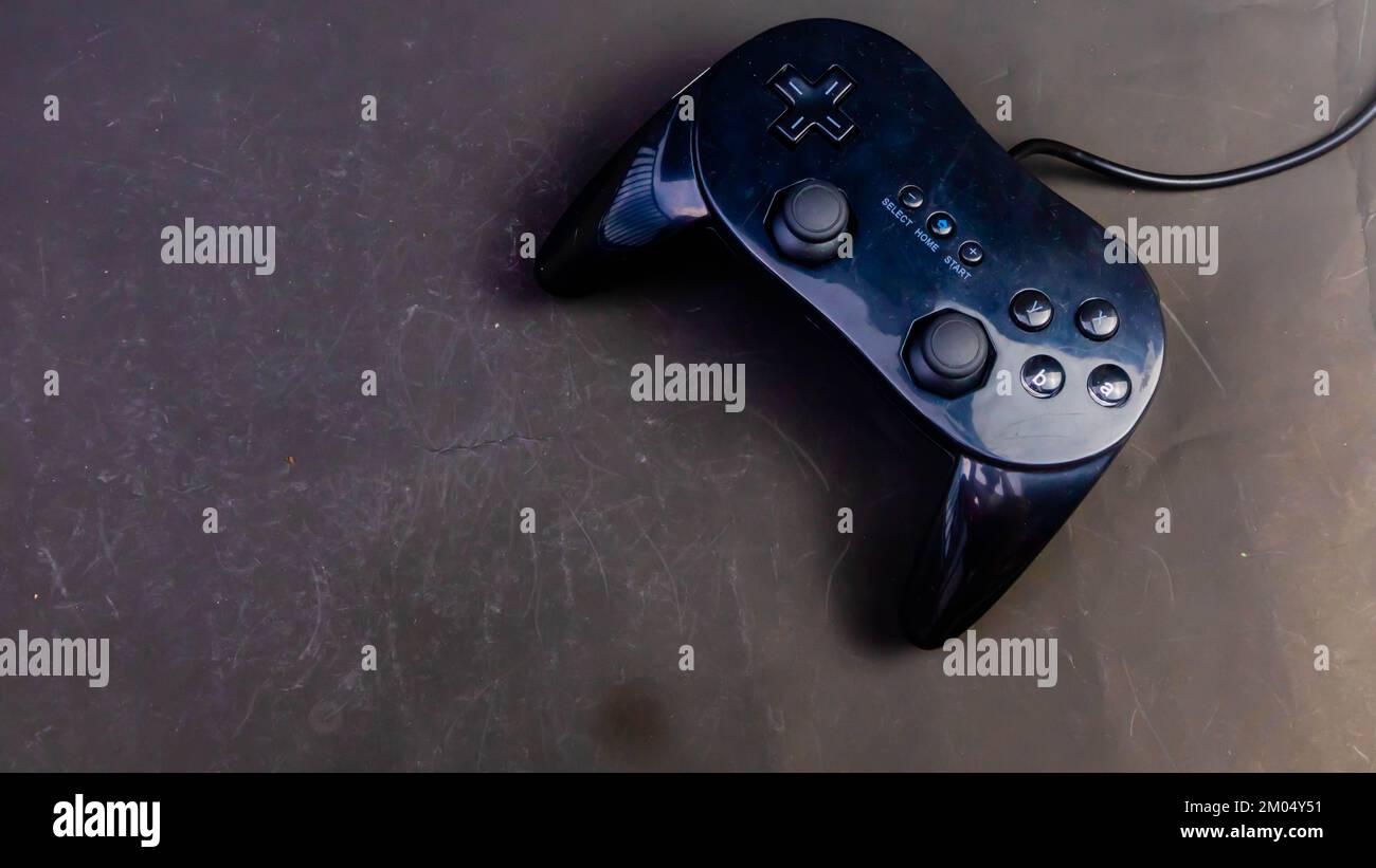 black joystick isolated on black background Stock Photo - Alamy