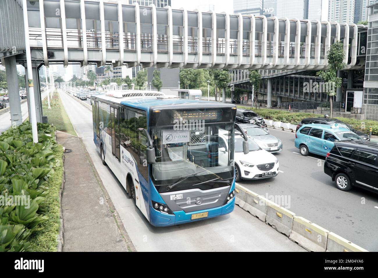 Trans Jakarta bus in bus way line, at the rush hour traffic. Location ...