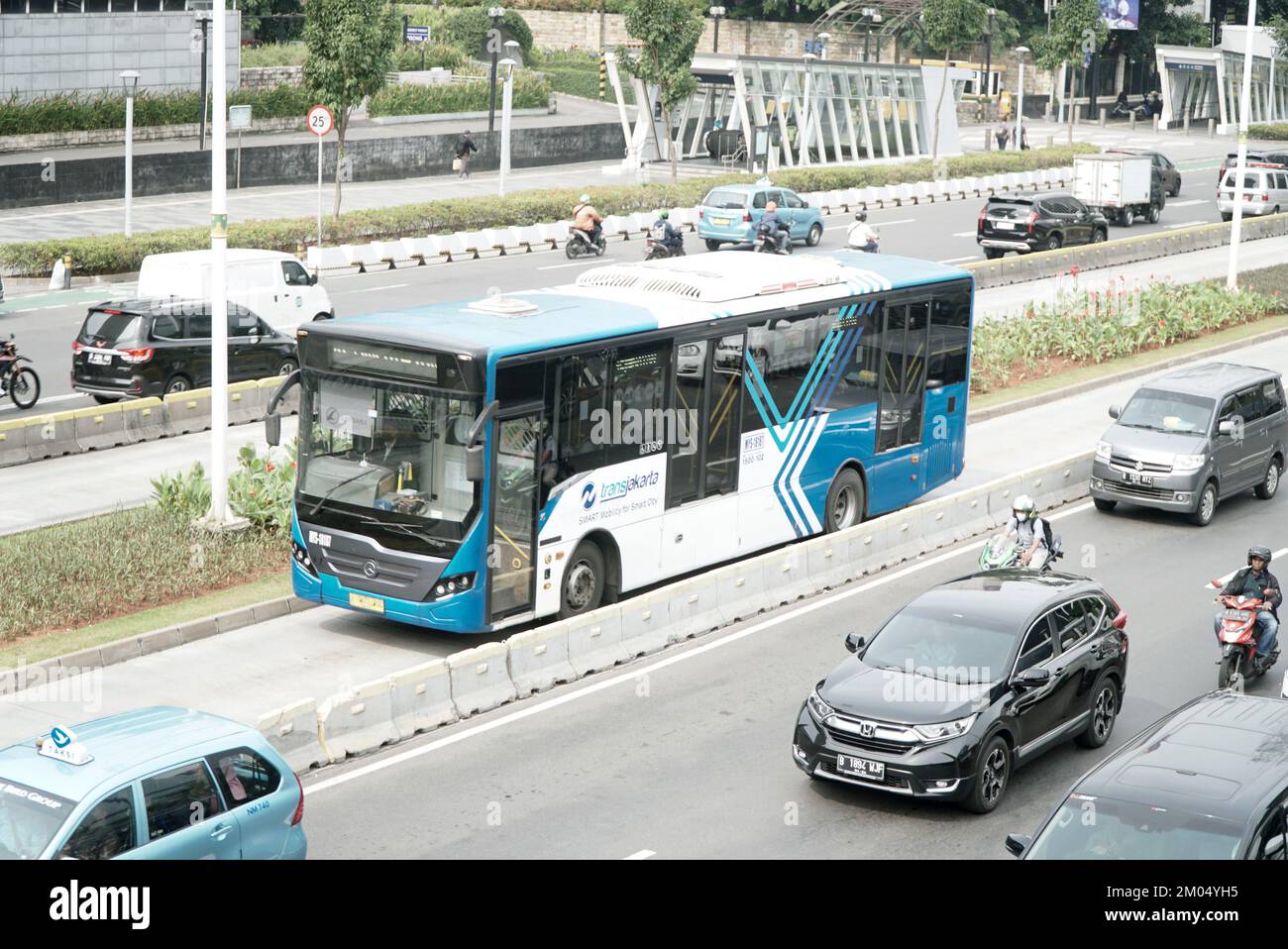 Trans Jakarta bus in bus way line, at the rush hour traffic. Location ...
