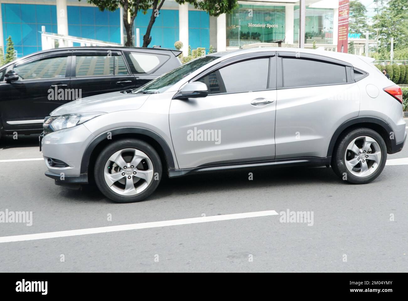Luxury mini SUV car in Silver color, all new Honda HR-V, driving in ...