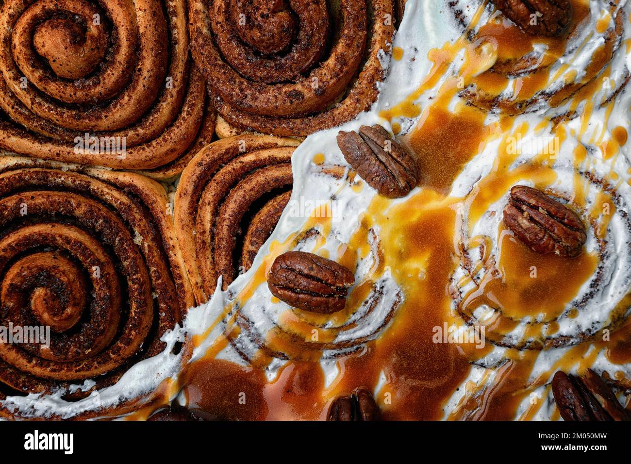 Cinnabon rolls with cinnamon, nougat, cream and nuts, close-up Stock ...