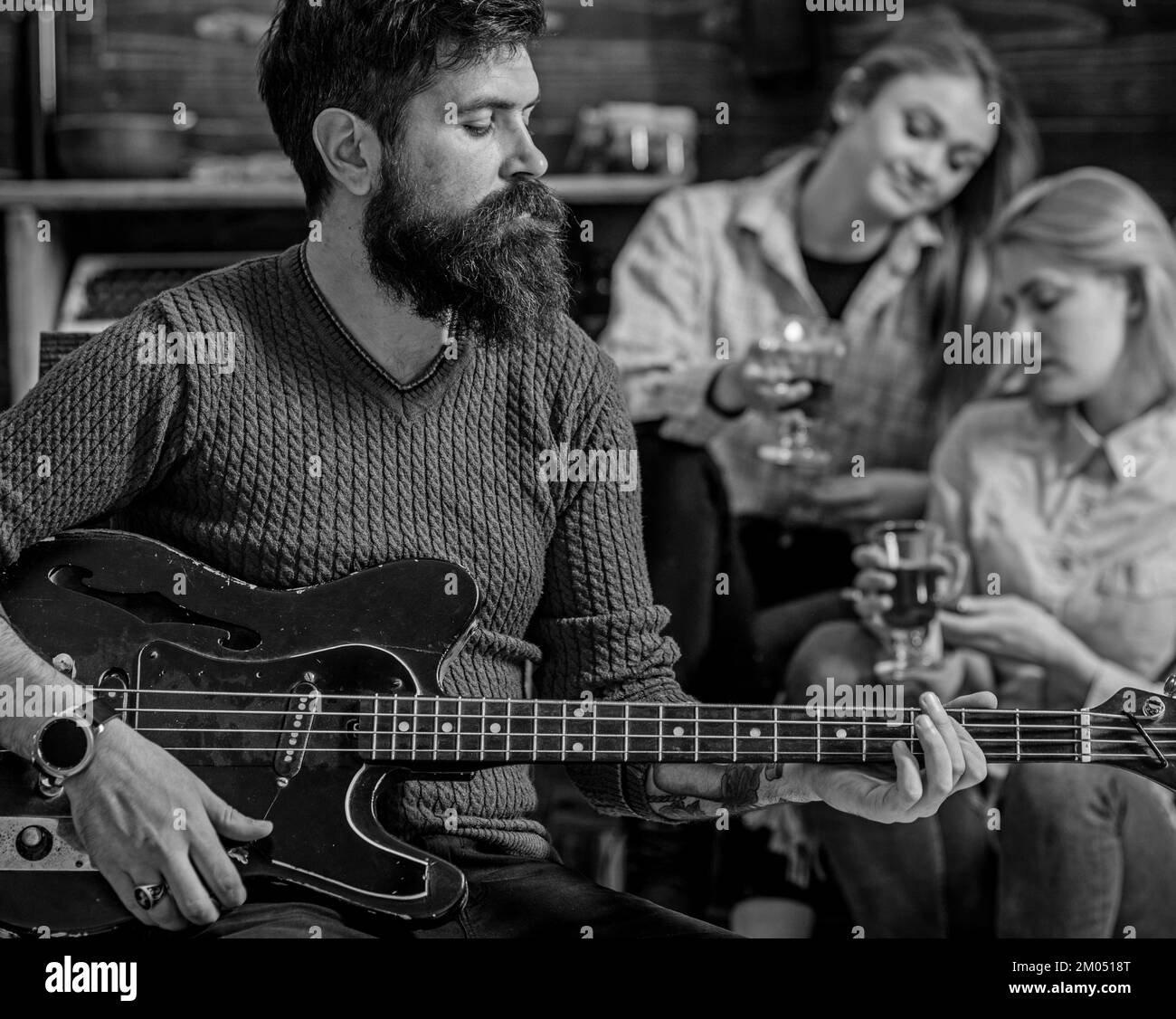 Guitarist playing at birthday, celebration concept. Bearded man ...