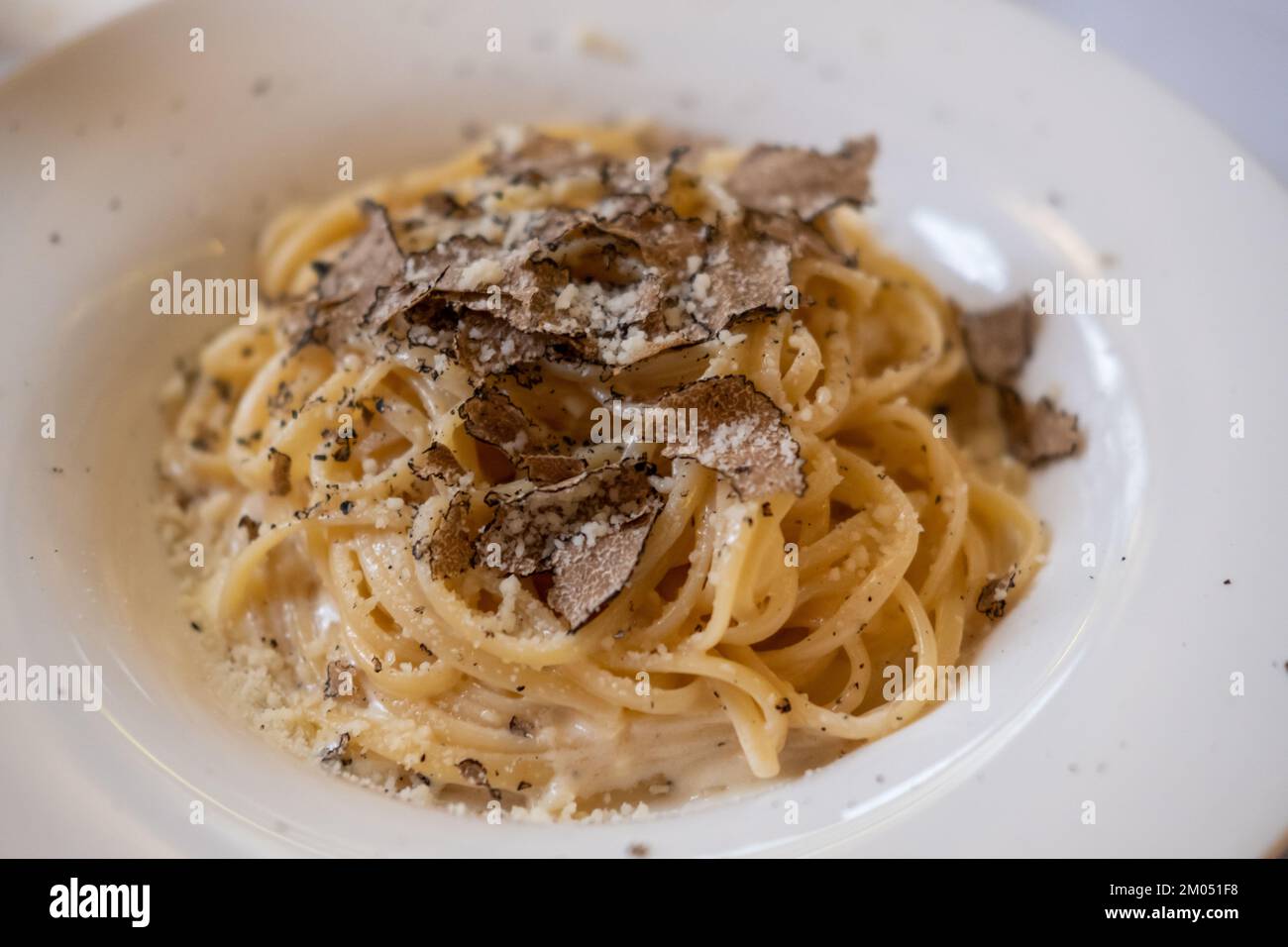 Black truffle spaghetti served on plate Stock Photo - Alamy